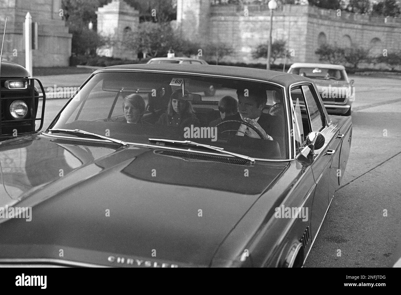 Sen. Edward Kennedy, driver, accompanied by David Kennedy, at left on ...
