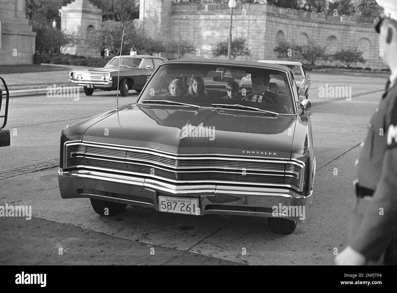 Sen. Edward Kennedy, driver, accompanied by David Kennedy, at left on ...