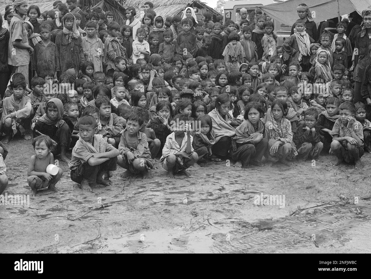 Cambodian refugee children congregate to watch visiting newsmen to this ...