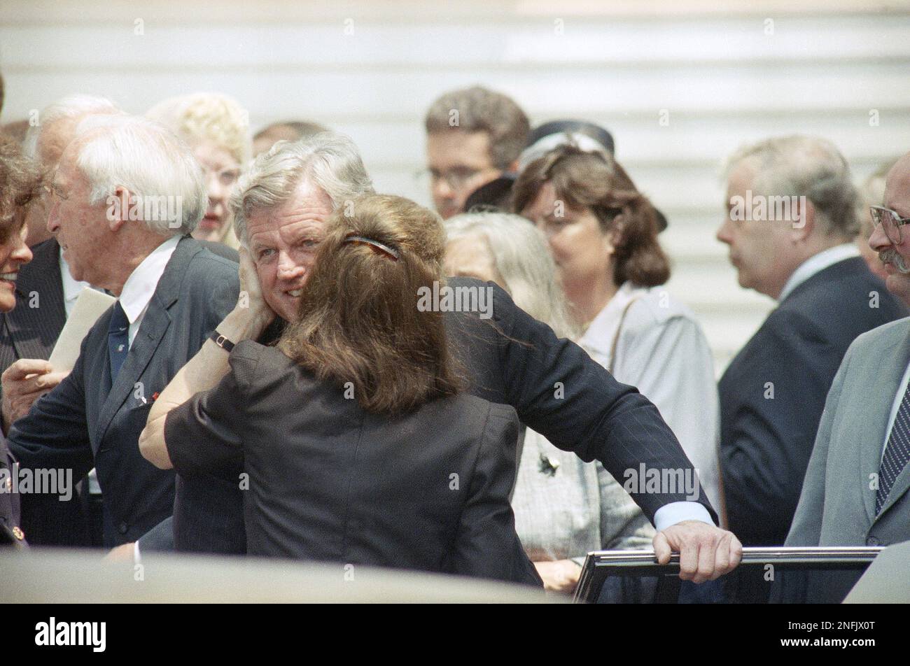 Sen. Edward Kennedy, center, gets hug from Jacqueline Kennedy Onassis ...