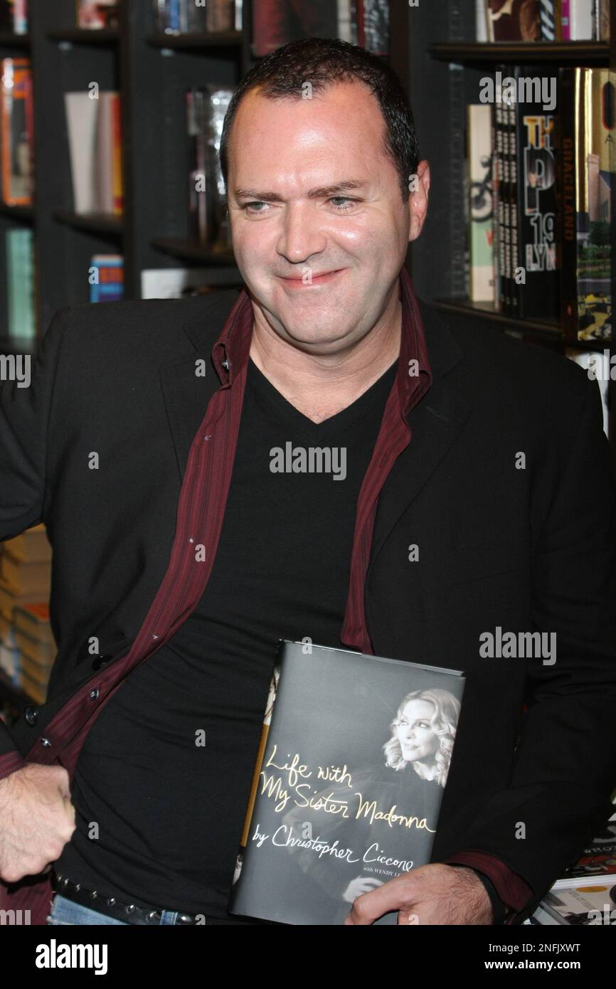 Christopher Ciccone poses with his memoir "Life With My Sister Madonna ...