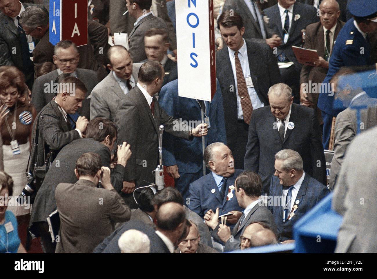 Reporters gather around Chicago's Mayor Richard Daley sitting under the ...