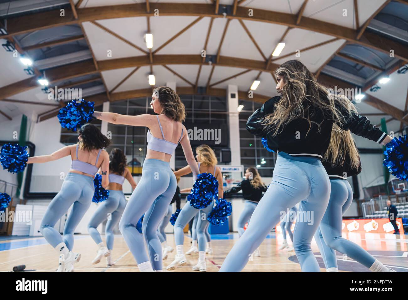 cheerleaders team dancing in the arena. High quality photo Stock Photo ...