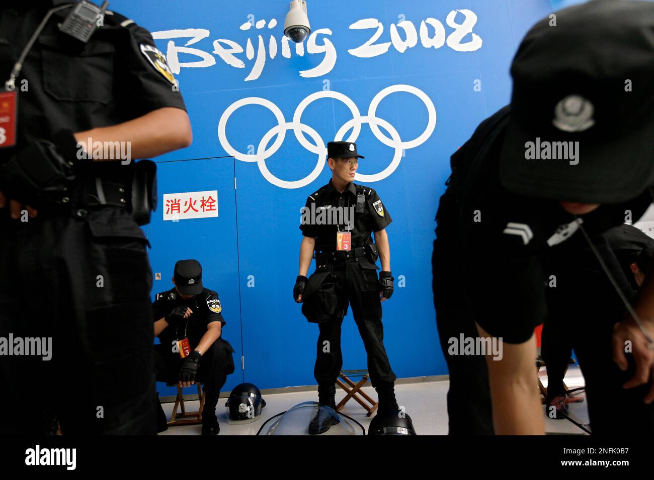 Chinese riot police officers wait for instructions inside the National ...