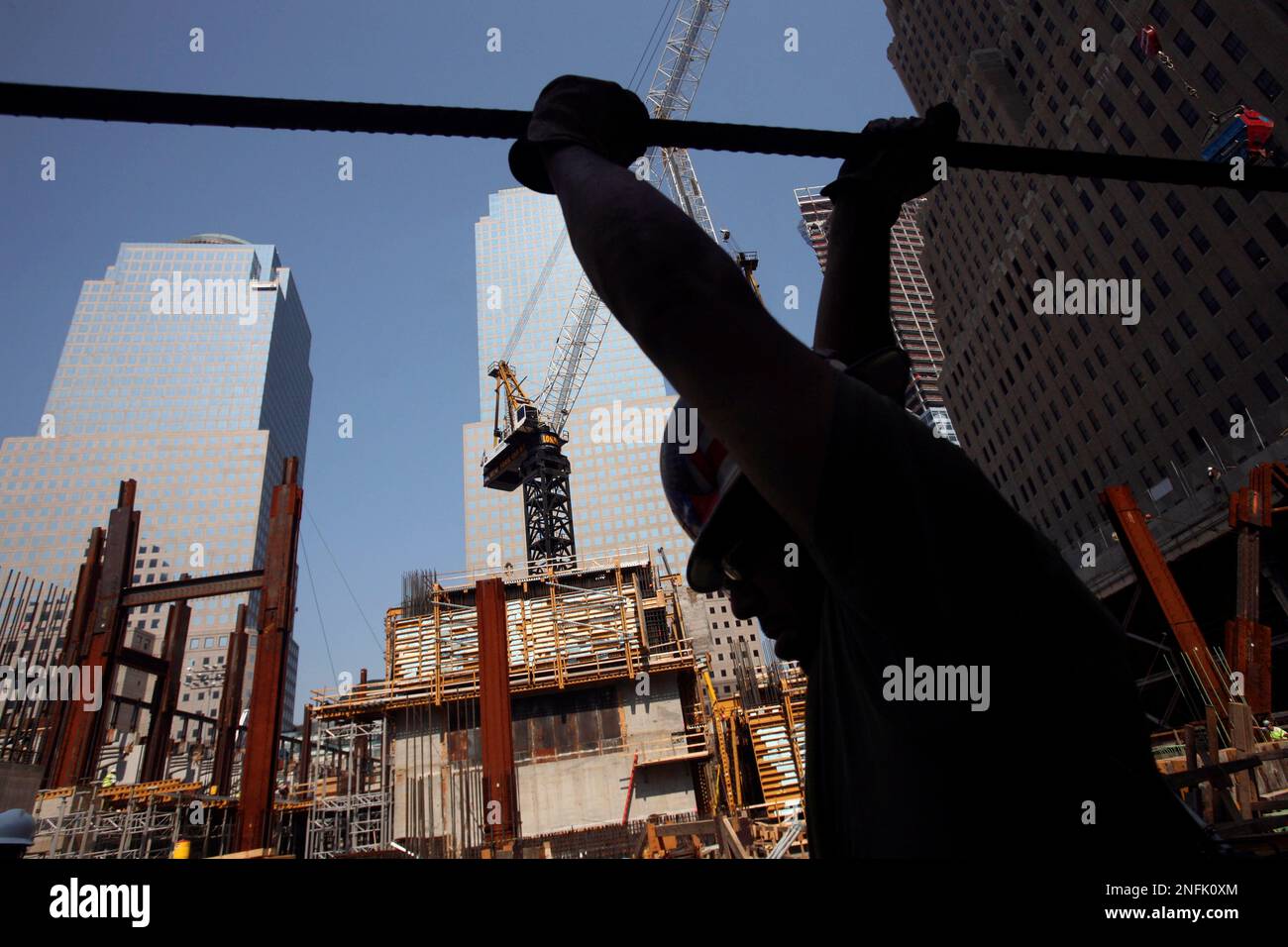 An ironworker carries a piece of steel at the Freedom Tower ...