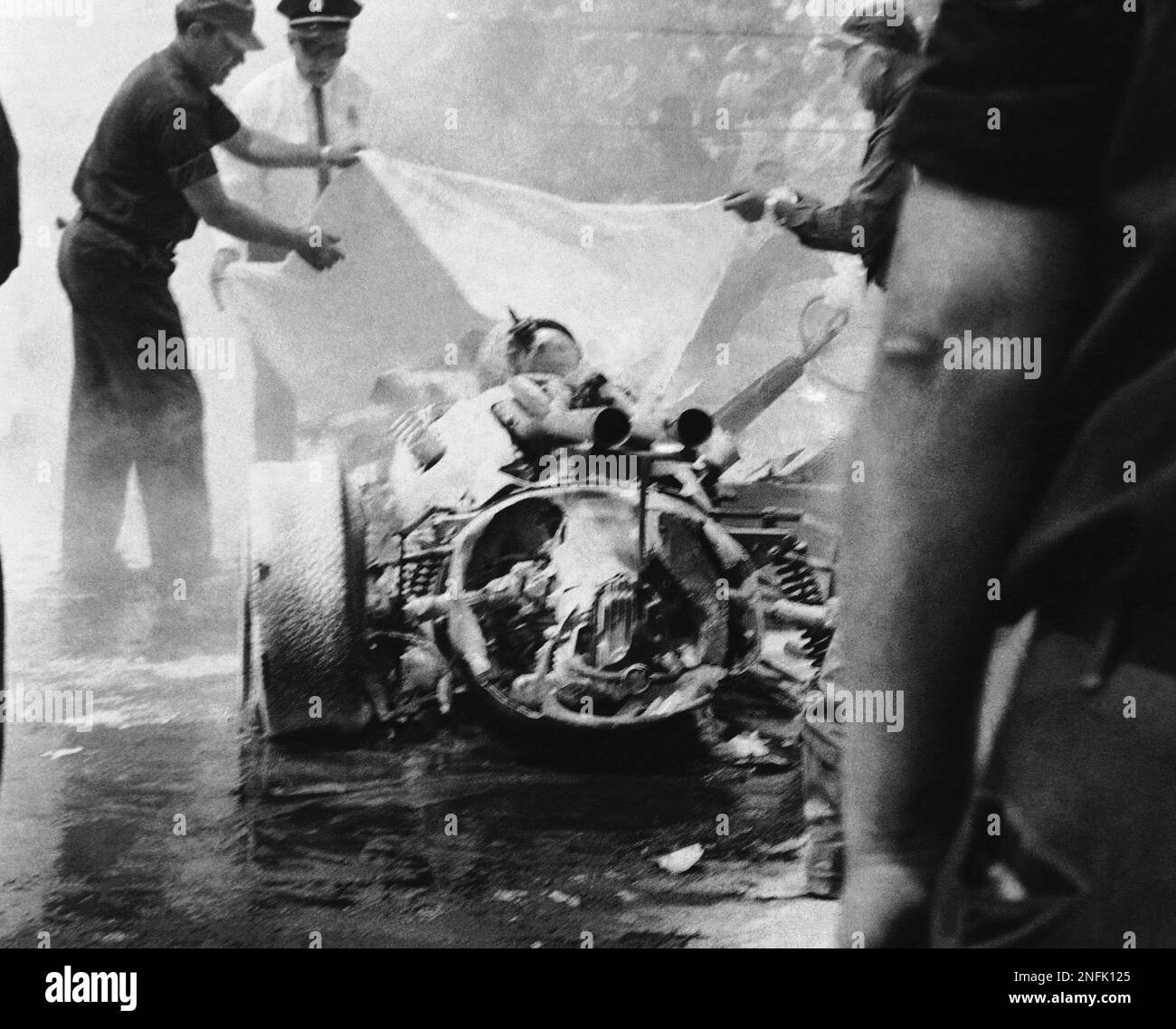 Auto racer Eddie Sachs' car is destroyed following a crash in the ...