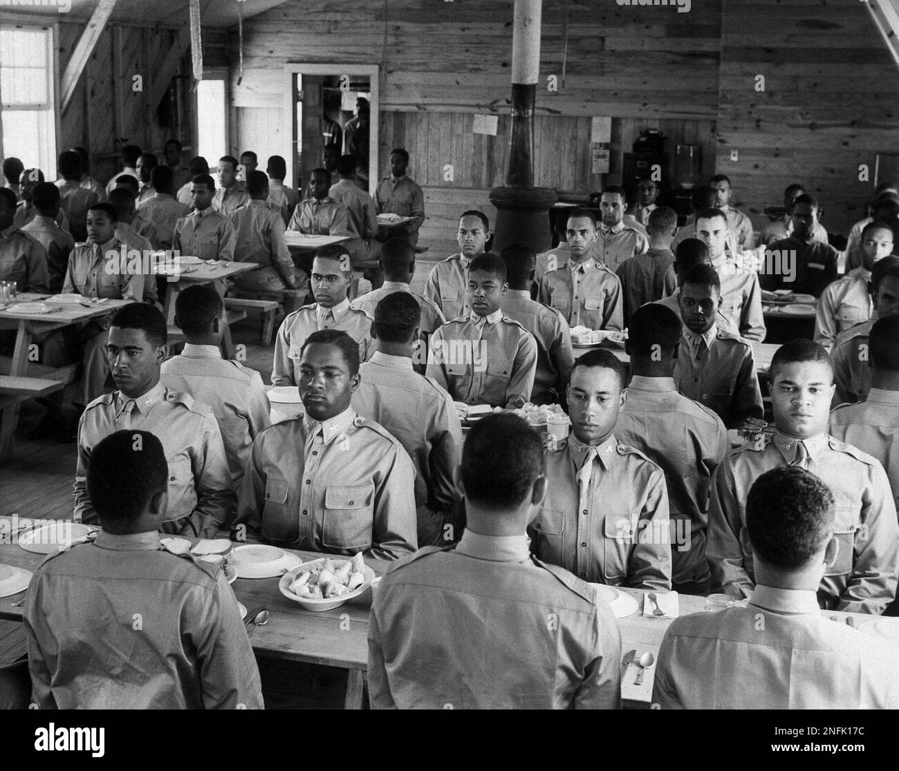 Cadets eat in a rough-hewn, but spotless mess hall at the Tuskegee Army ...