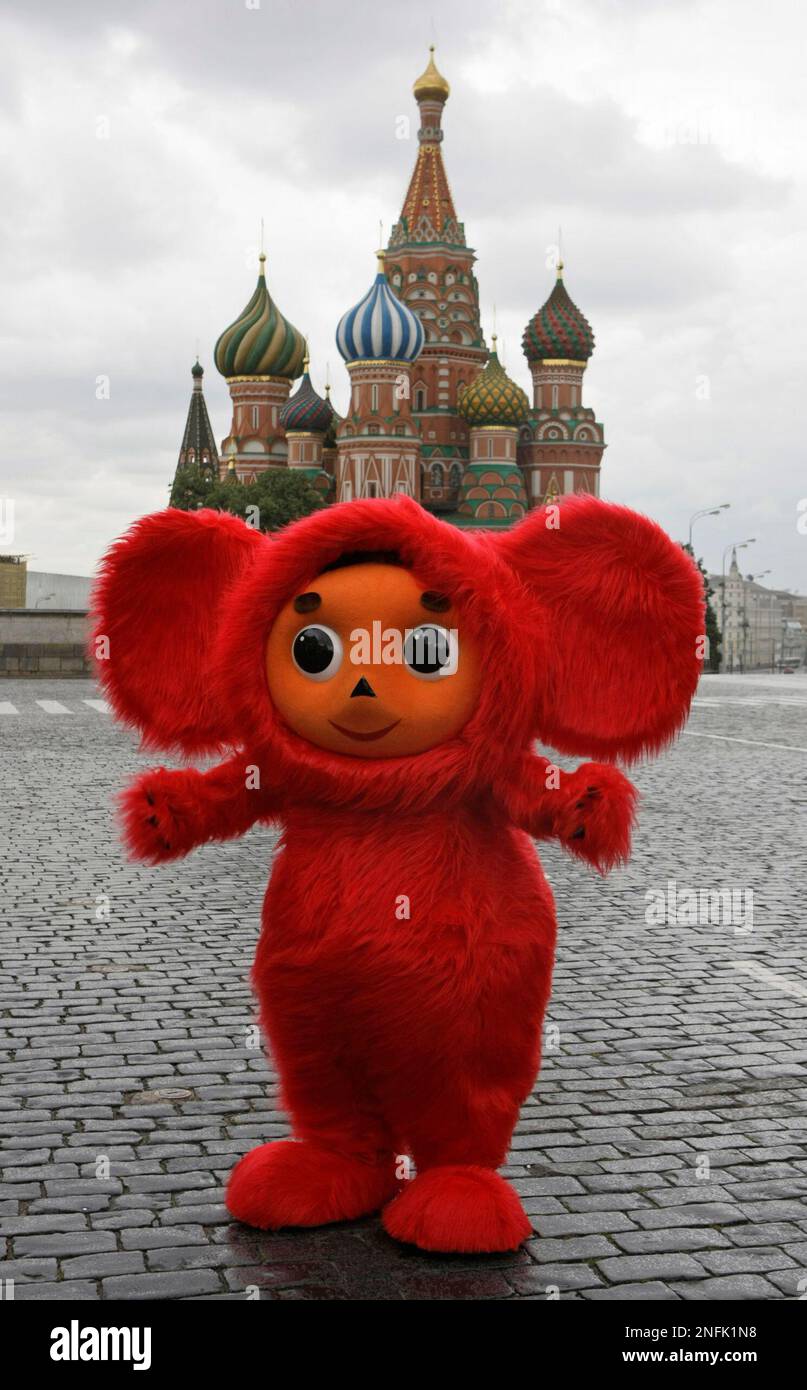 An actor performing Russian Olympic team's mascot called Cheburashka, a ...