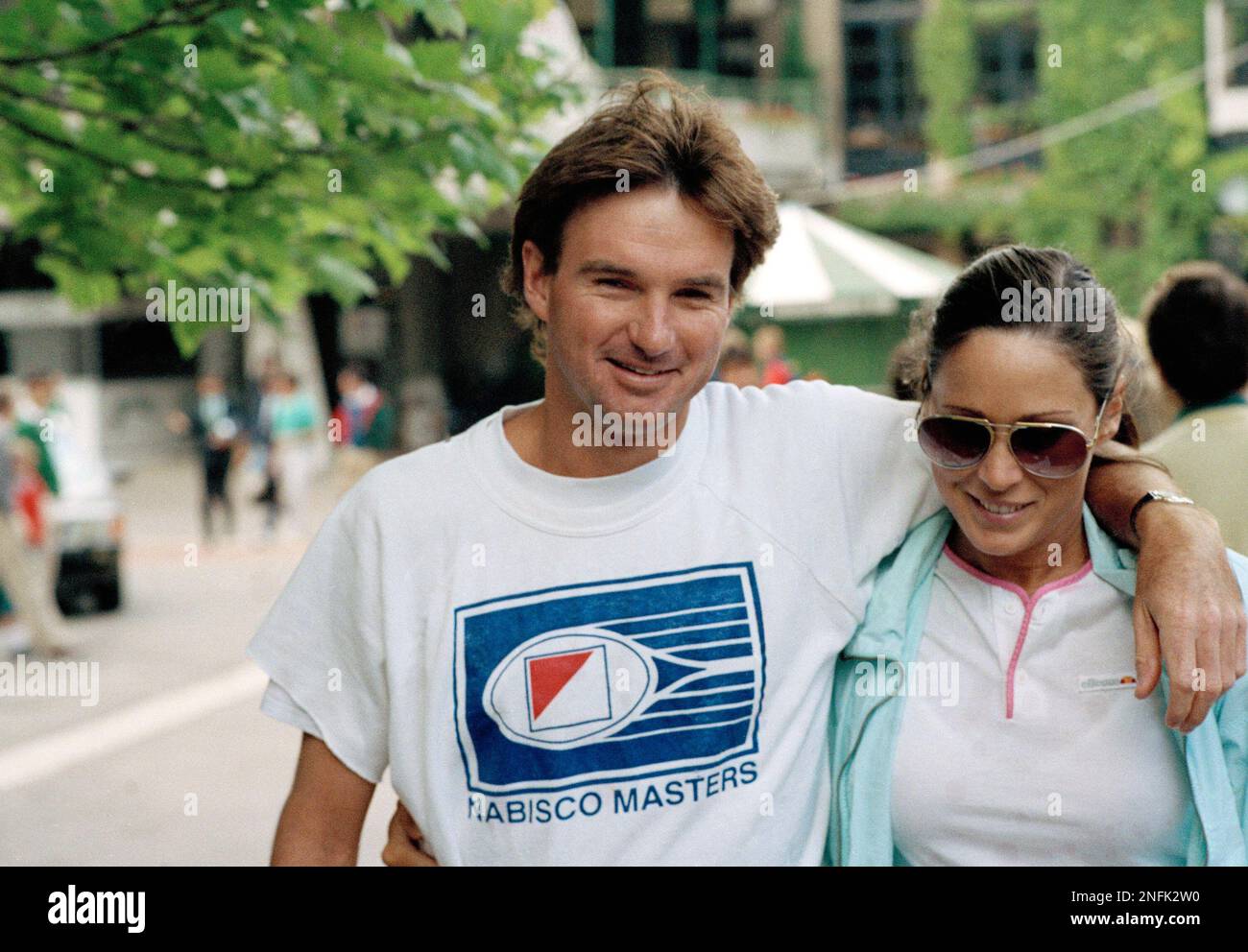American tennis ace Jimmy Connors walks with his arm around his wife ...