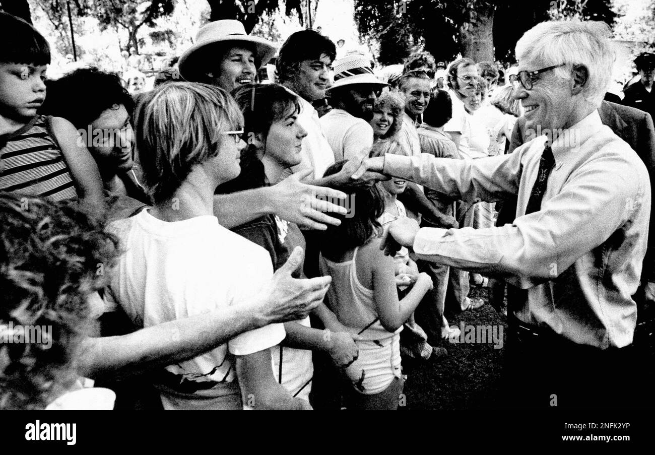 Using a two handed technique, John Anderson shakes hands with well ...