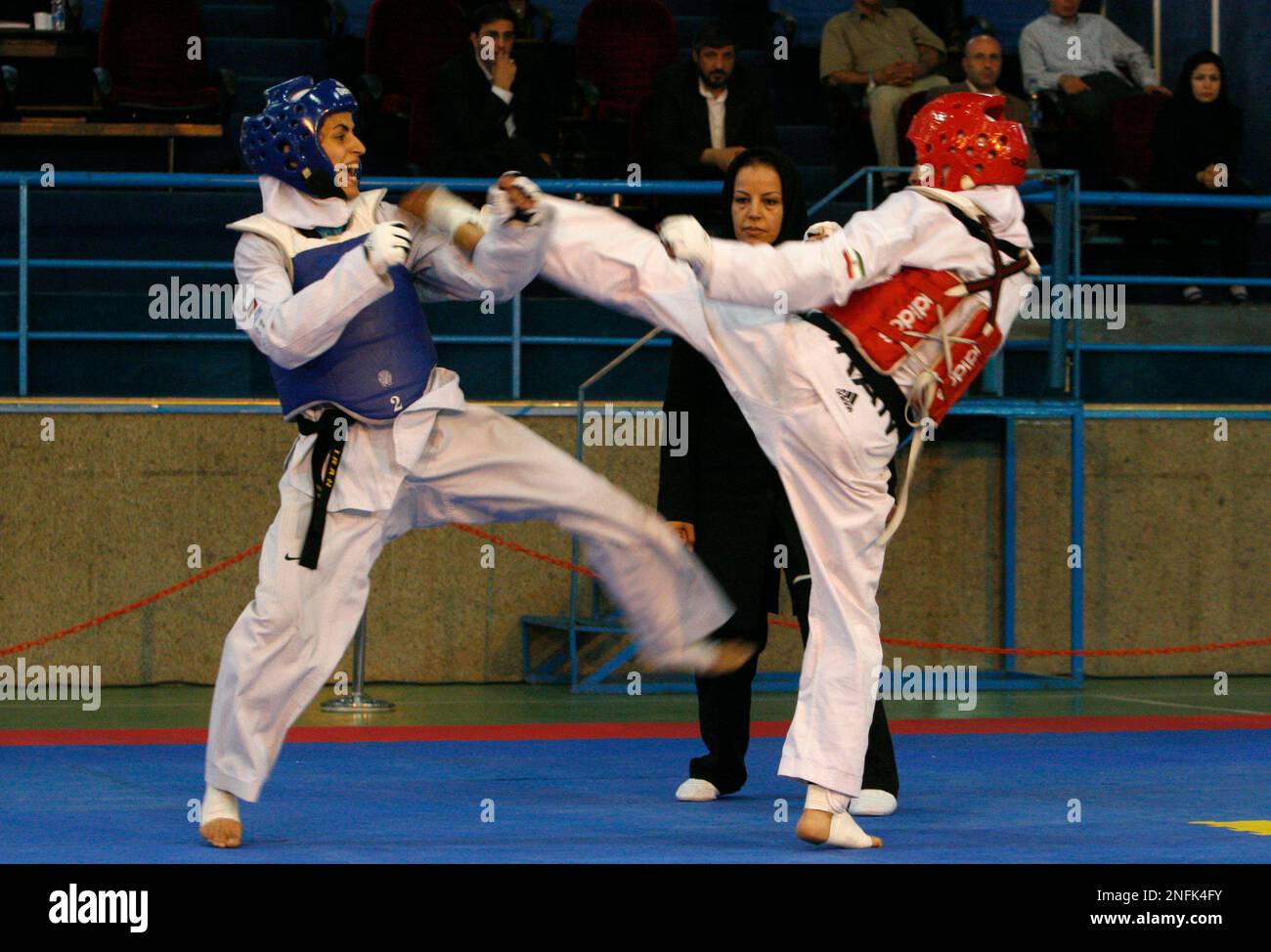 Iranian Sara Khoshjamal Fekri, left, competes with her Iranian rival ...