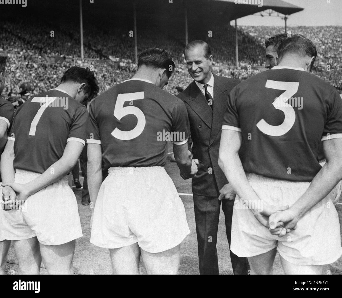 Prince Philip , Duke of Edinburgh, shakes hands with Ron Cope, one of ...