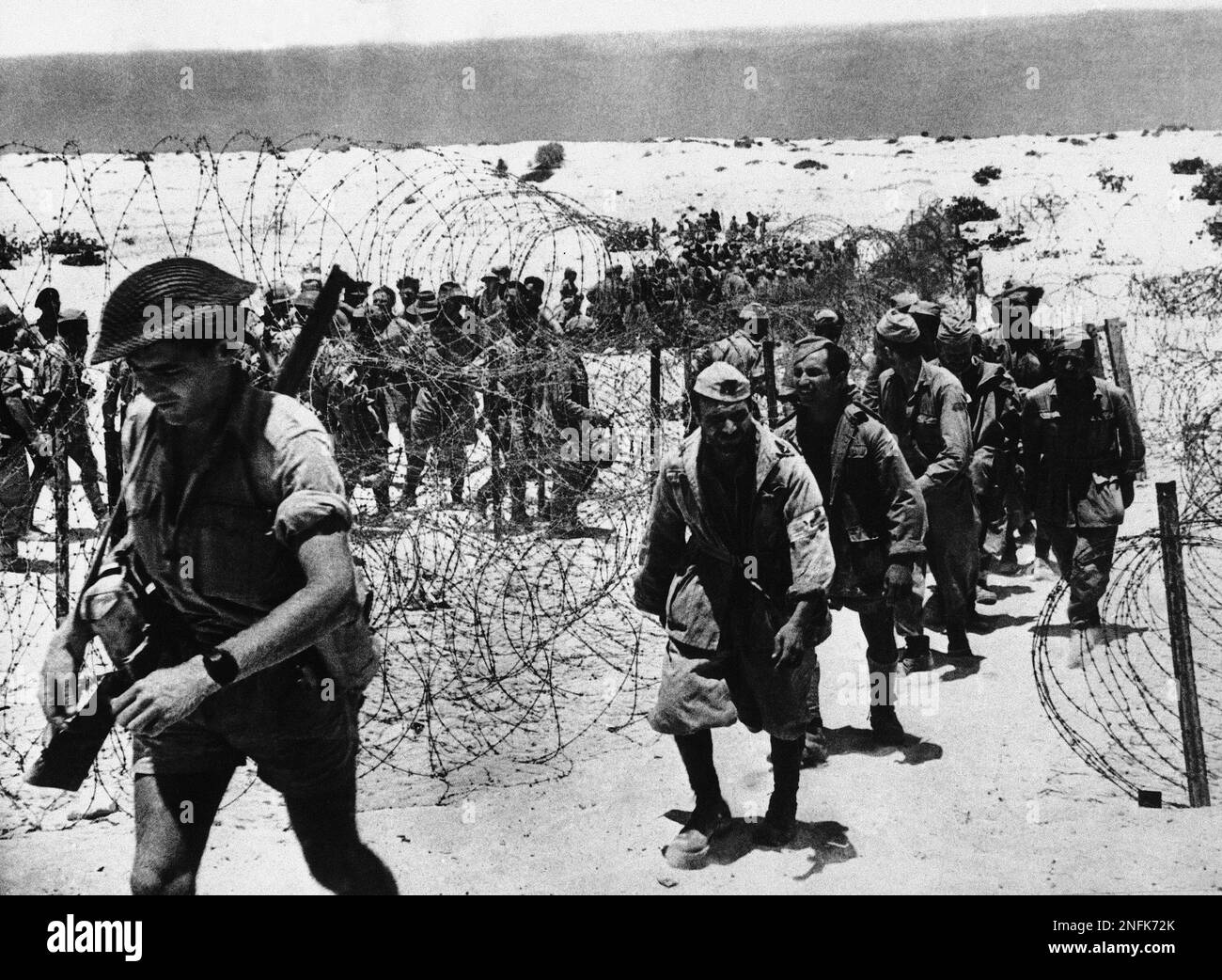 In this British Official Photo, Italian prisoners of war captured in ...