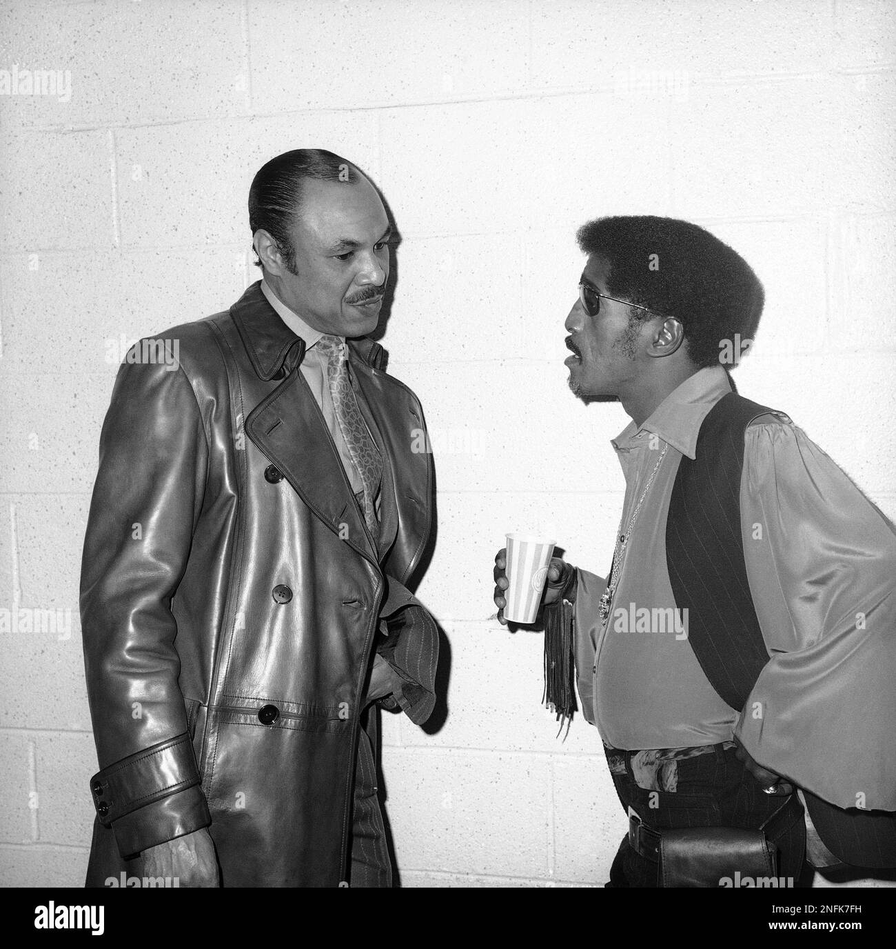 Mercer Ellington, son of Duke Ellington, left, talks with Sammy Davis ...