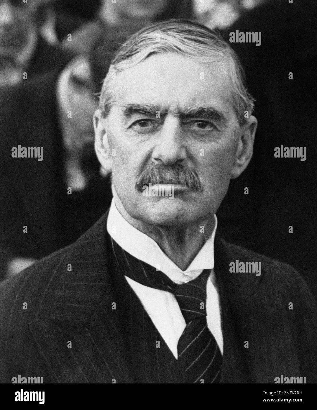 British Prime Minister Neville Chamberlain had an ominous frown in this ...