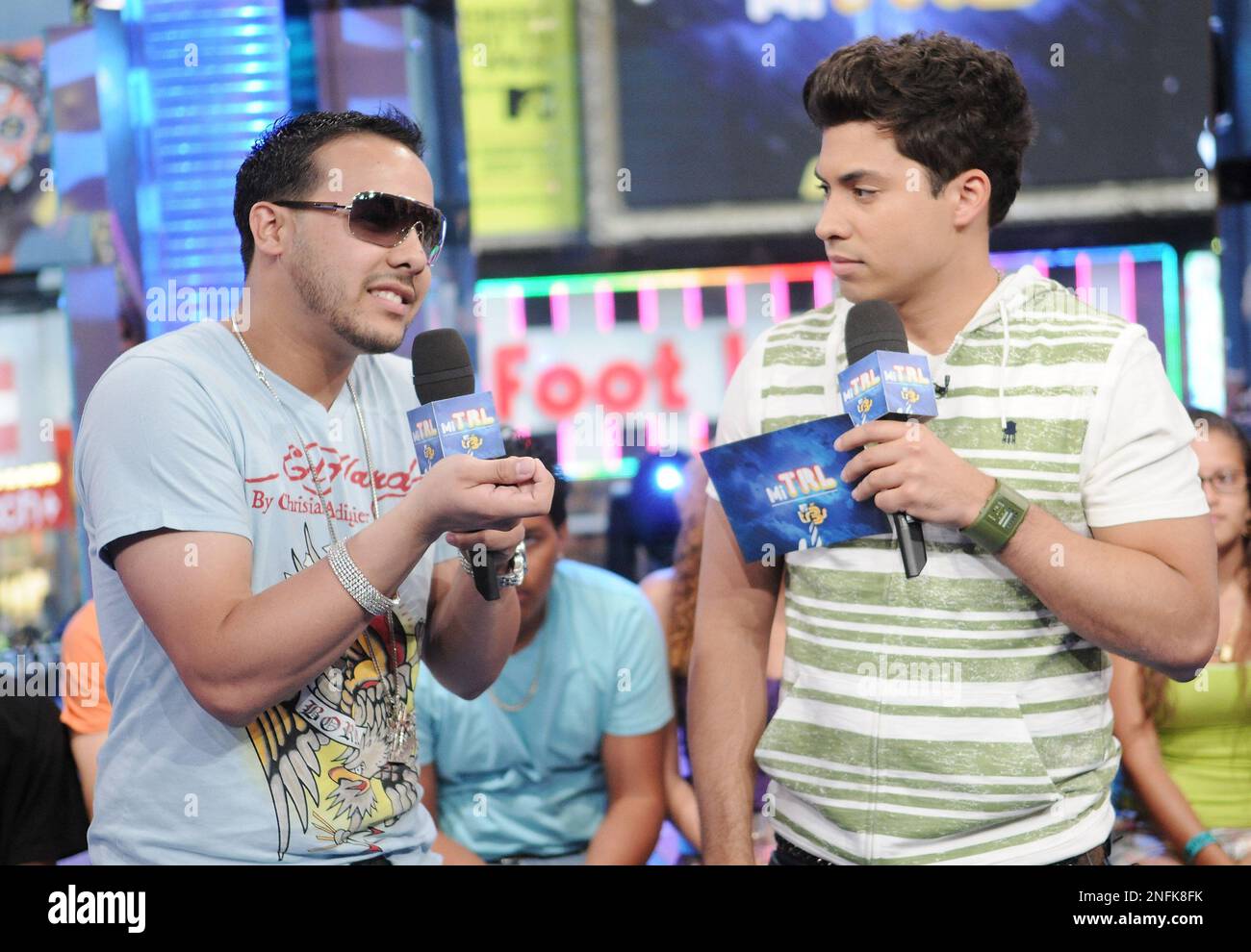 Puerto Rican rapper MJ, left, chats with VJ Carlos Santos during an ...