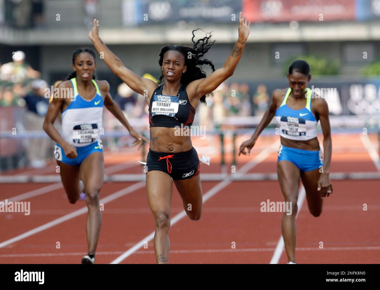 Tiffany Ross-Williams crosses the finish line to win the women's 400 ...
