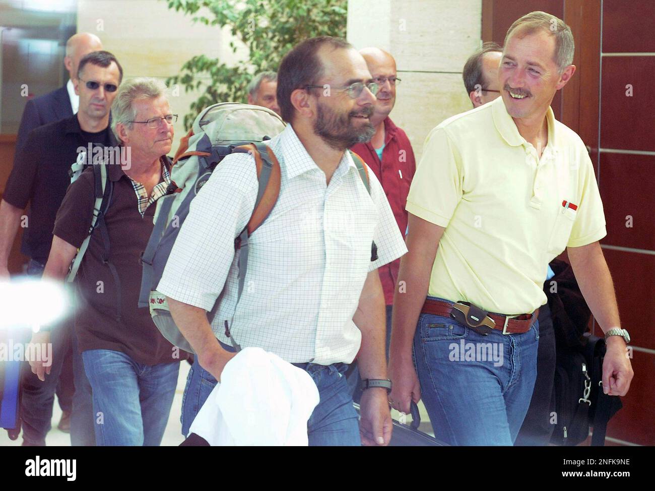 German climbers Martin Scholz, center, and Helmut Hainzlmeier, 2nd left ...