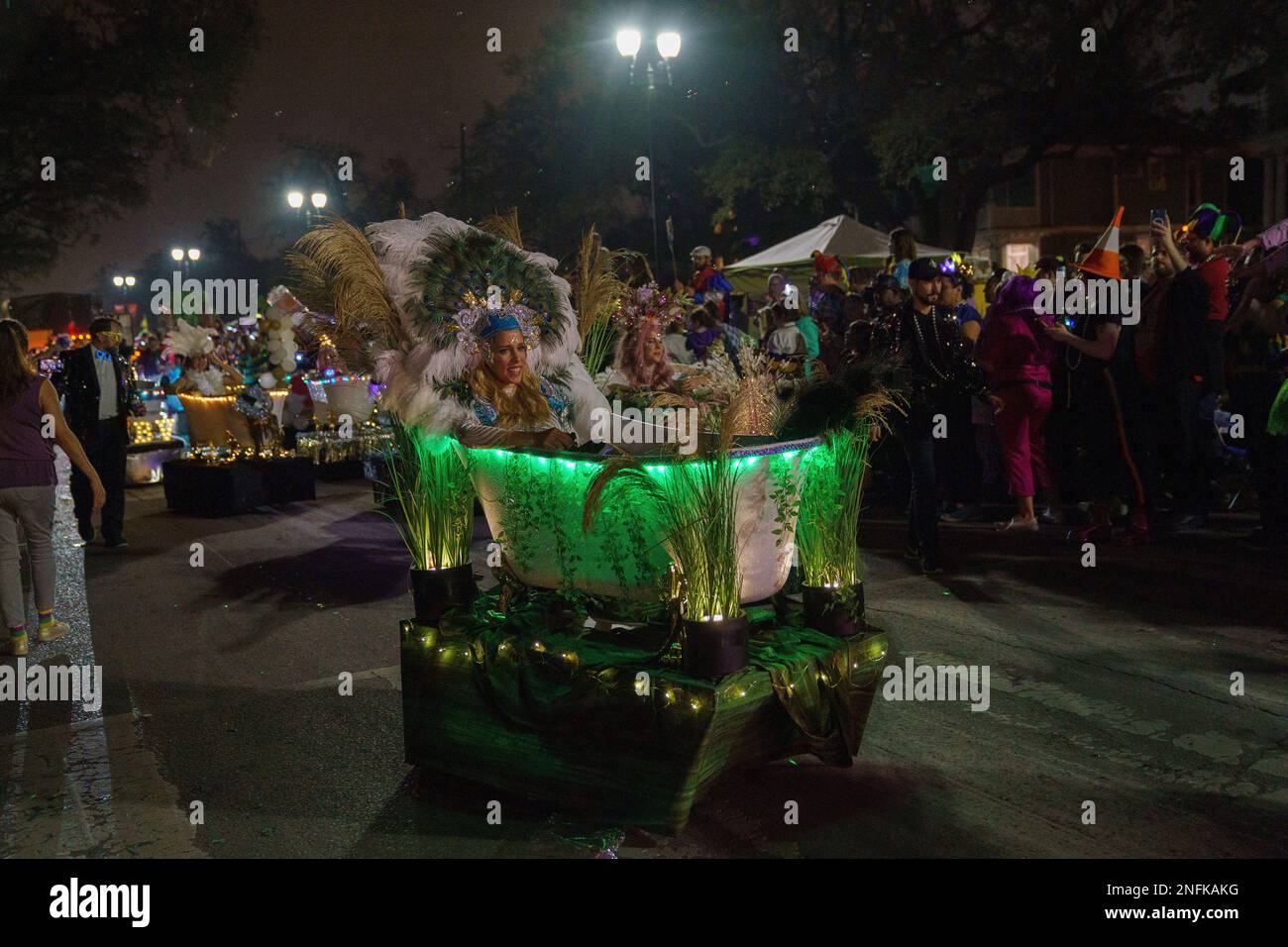 Parade goers and floats are seen at the Krewe Of Muses Parade during ...