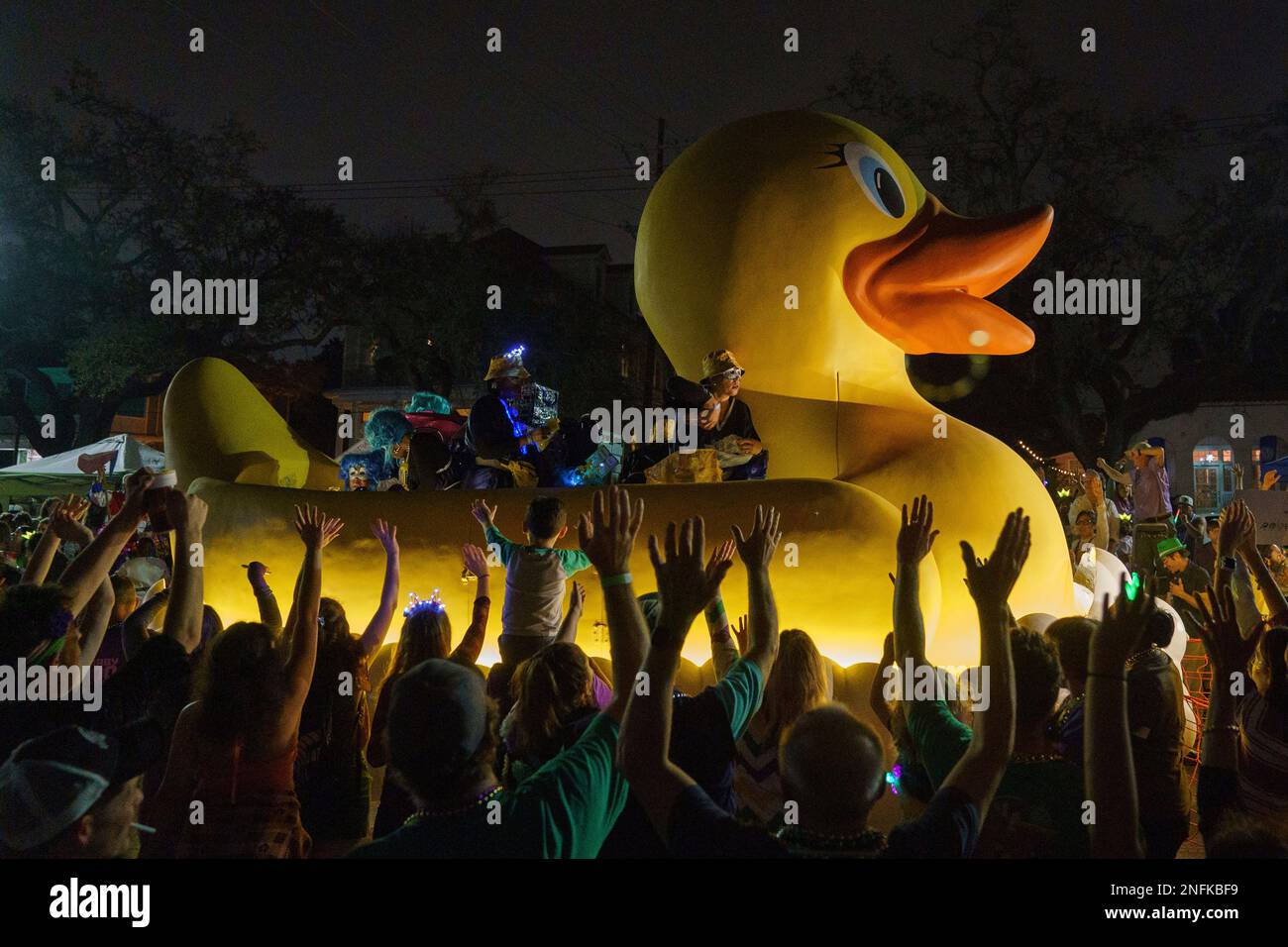 Parade goers and floats are seen at the Krewe Of Muses Parade during ...