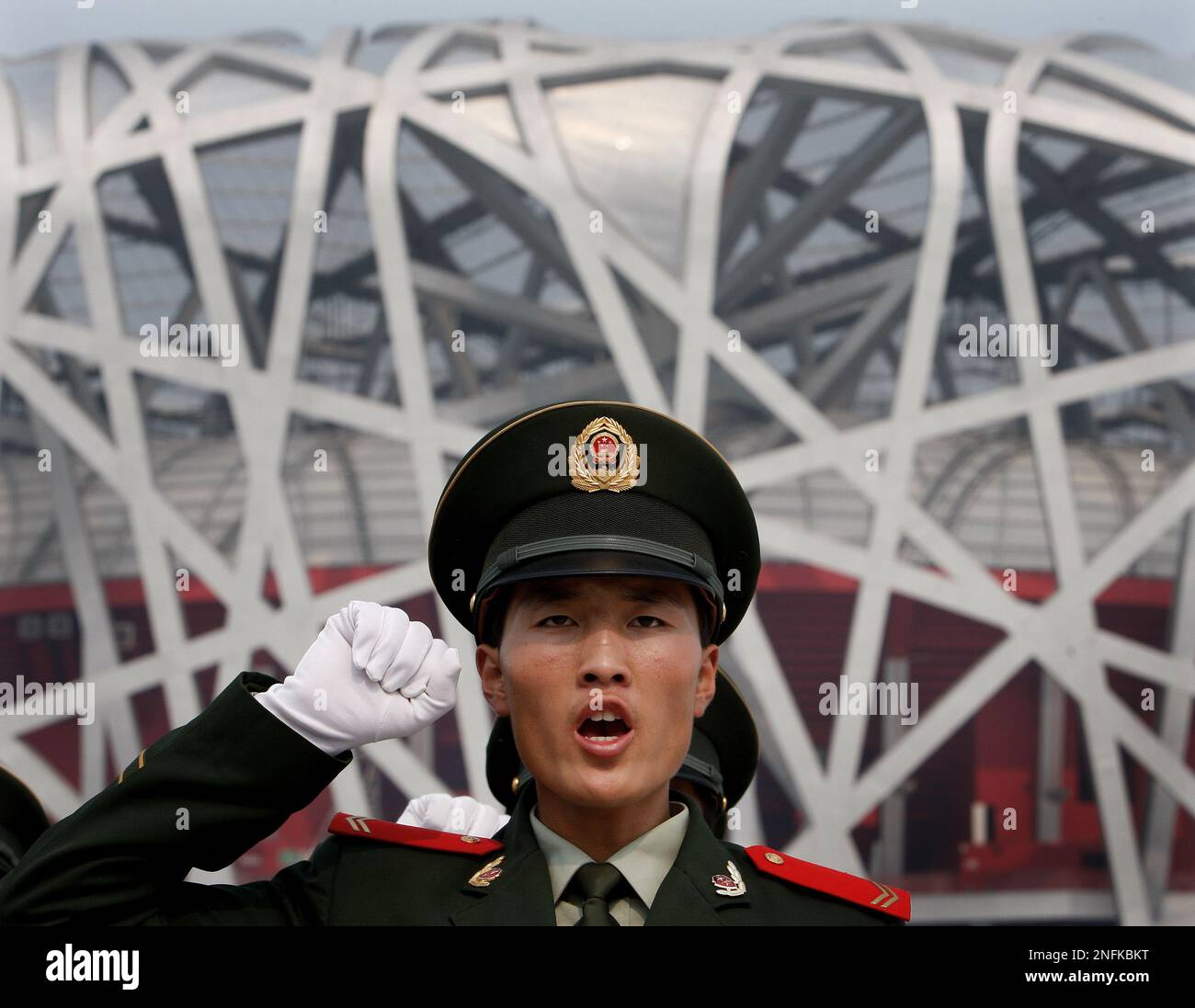 Chinese paramilitary police officers chant an oath to ensure safety ...