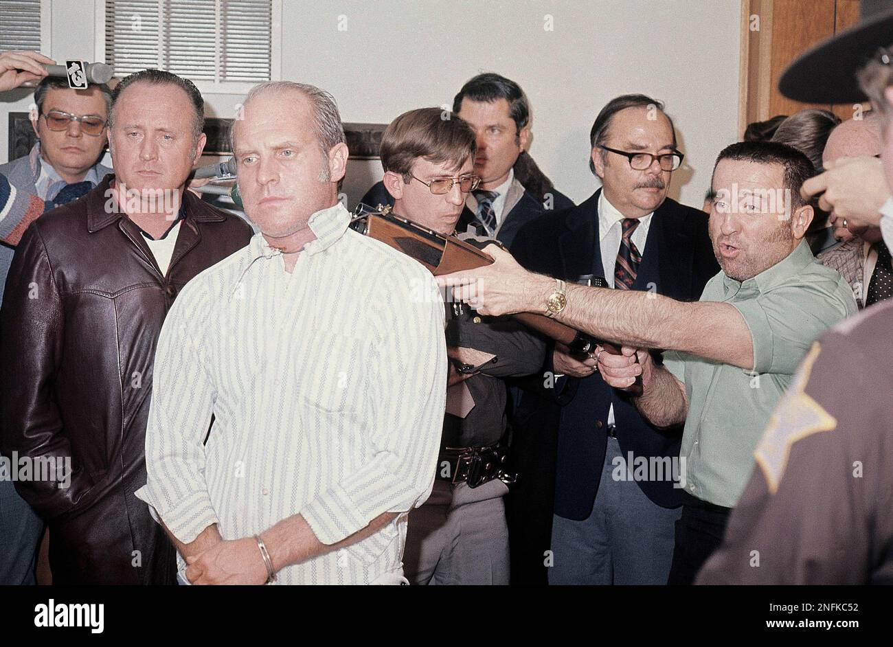 Anthony Kiritsis holds a shotgun to his hostage Richard O. Hall's neck ...