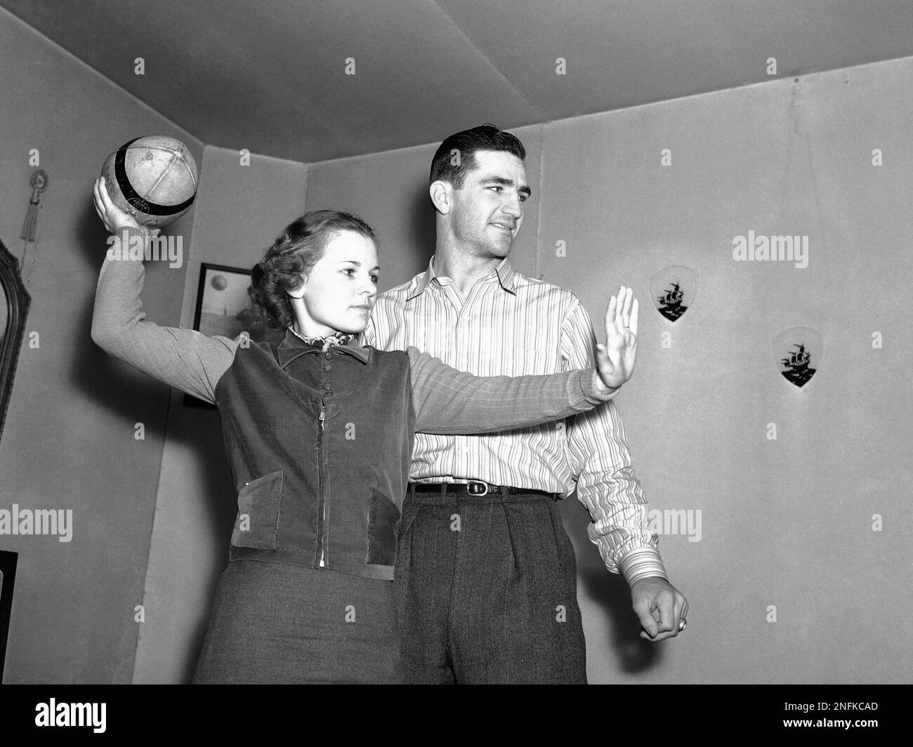 The Washington Redskins, Sammy Baugh, gives some tips to his fiancée ...