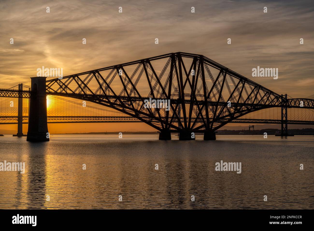 The Forth Rail Bridge at sunset, with the Forth Road Bridge and ...