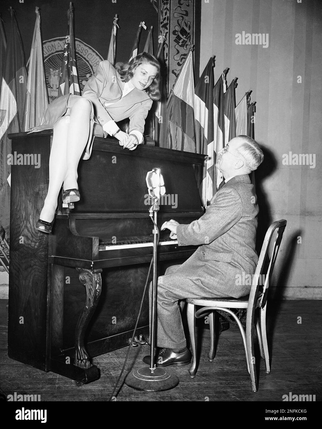 Vice President Harry S. Truman plays the piano as the new movie star ...