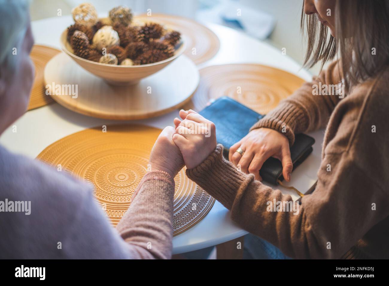 Woman mother praying table hi-res stock photography and images - Alamy