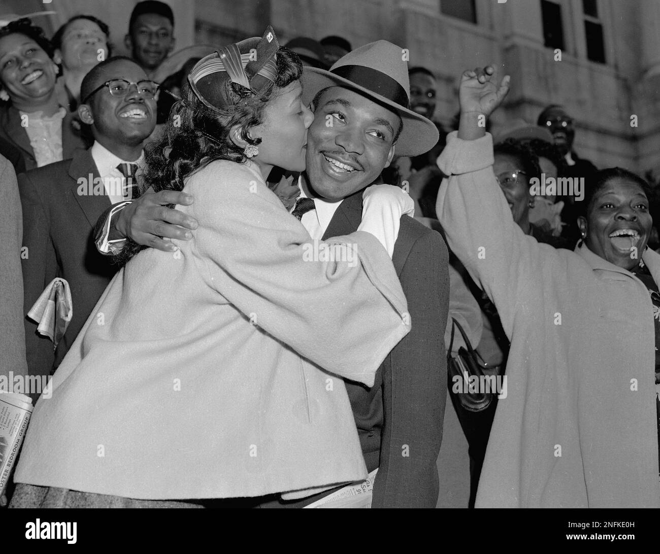 The Rev. Martin Luther King Jr. is welcomed with a kiss by his wife ...