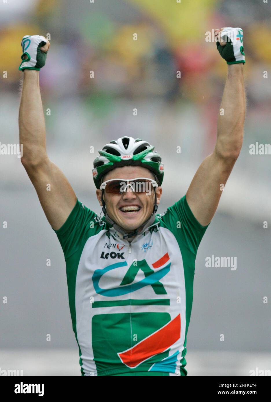 Simon Gerrans of Australia reacts as he crosses the finish line to win ...