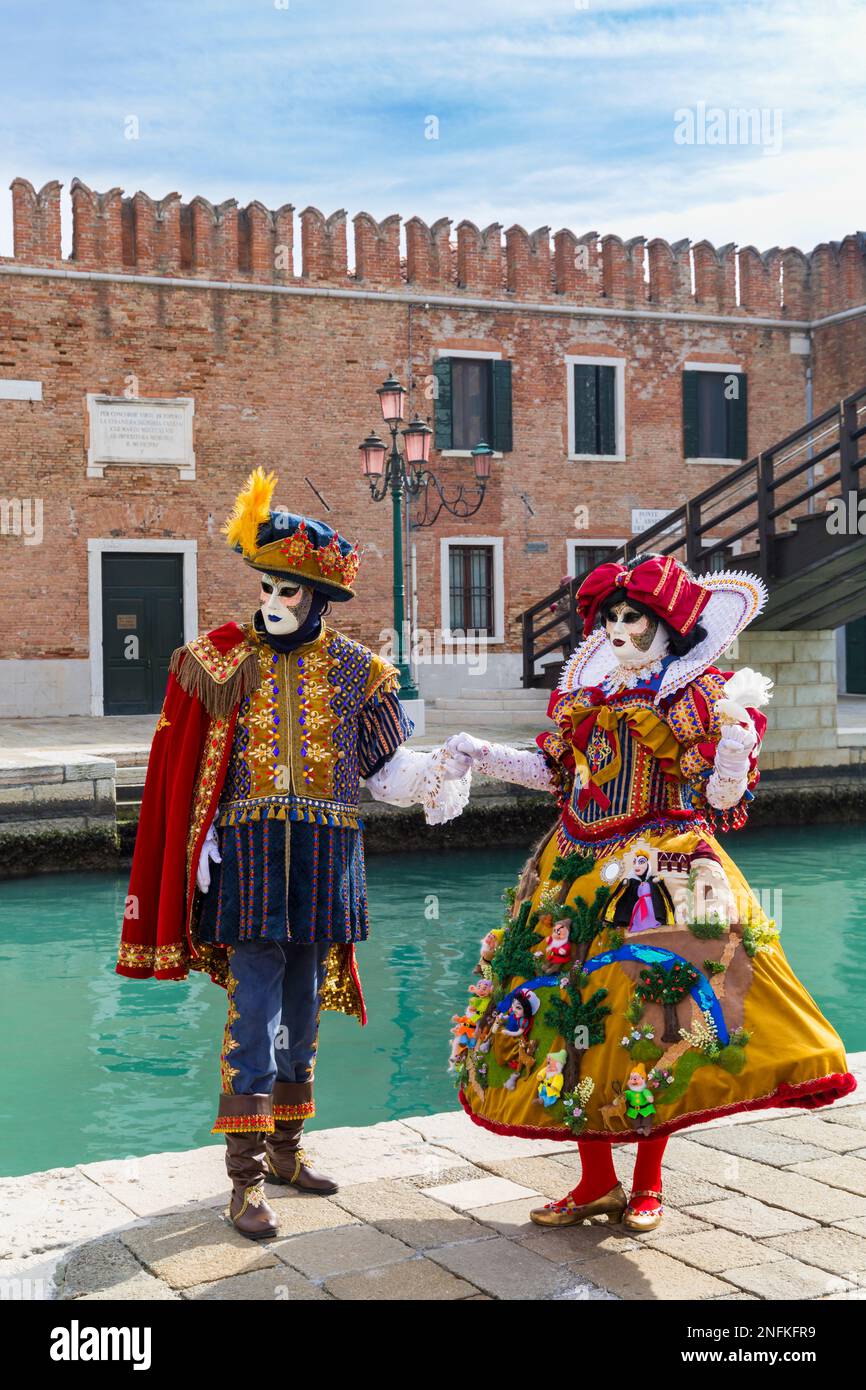 Carnival goers dressed in splendid colourful costumes and masks during ...