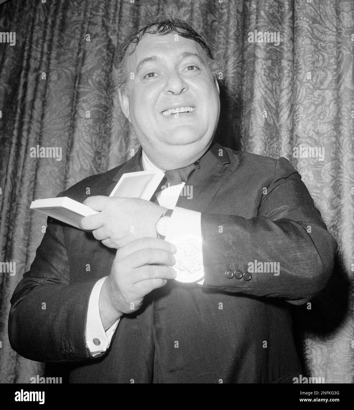 Zero Mostel, shown trying on his Tony award as a cuff link, April 28 ...
