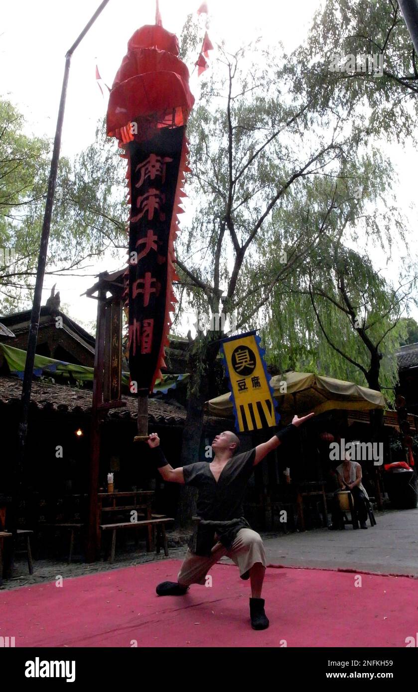 A traditional street performer shows his performance at an amusement ...