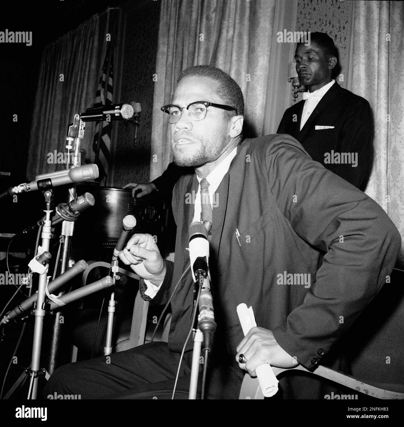 Nation of Islam leader Malcolm X speaks to television newsmen at Duffy ...