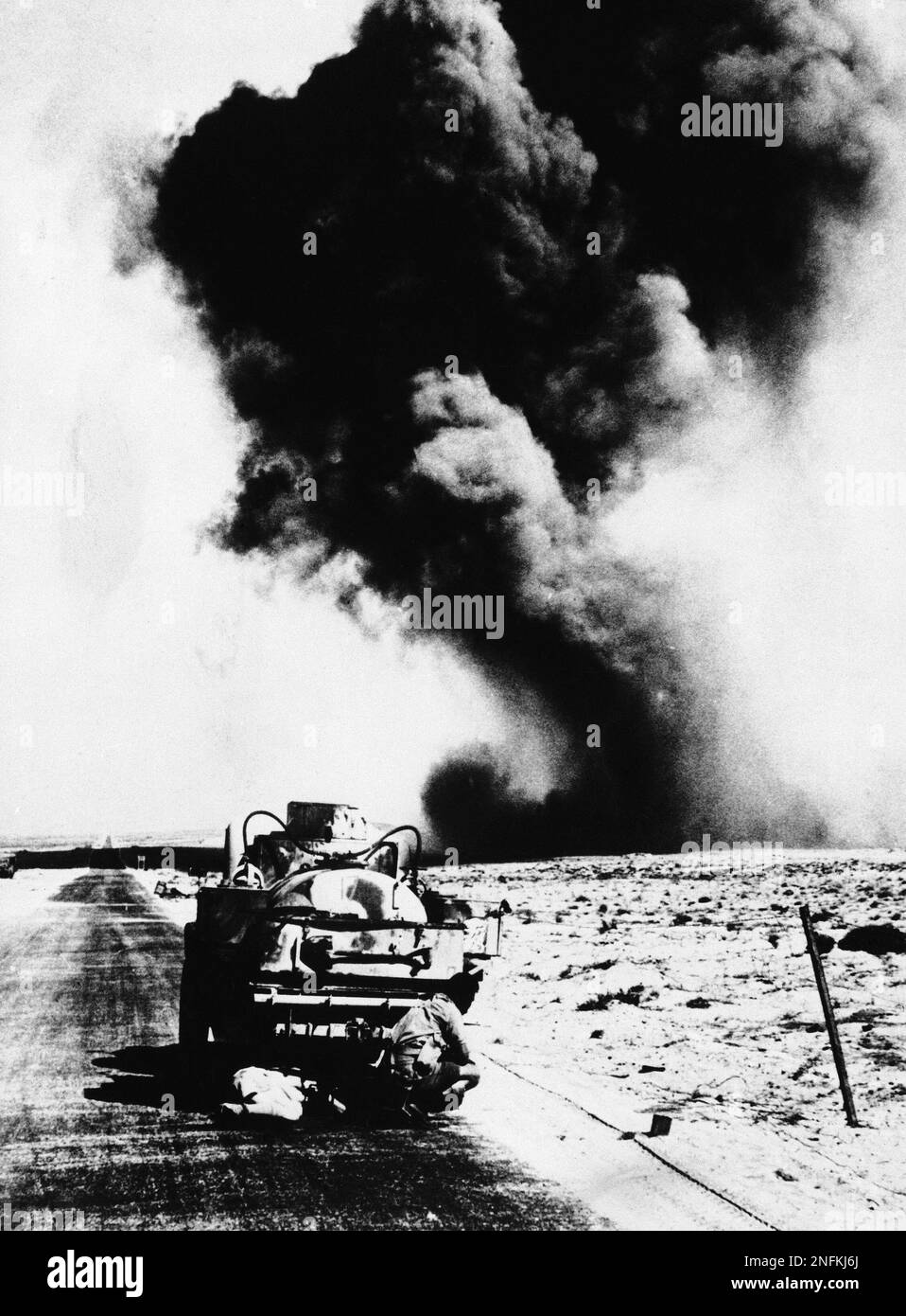 Infantryman take cover behind their water truck as a 2000-pound bomb ...