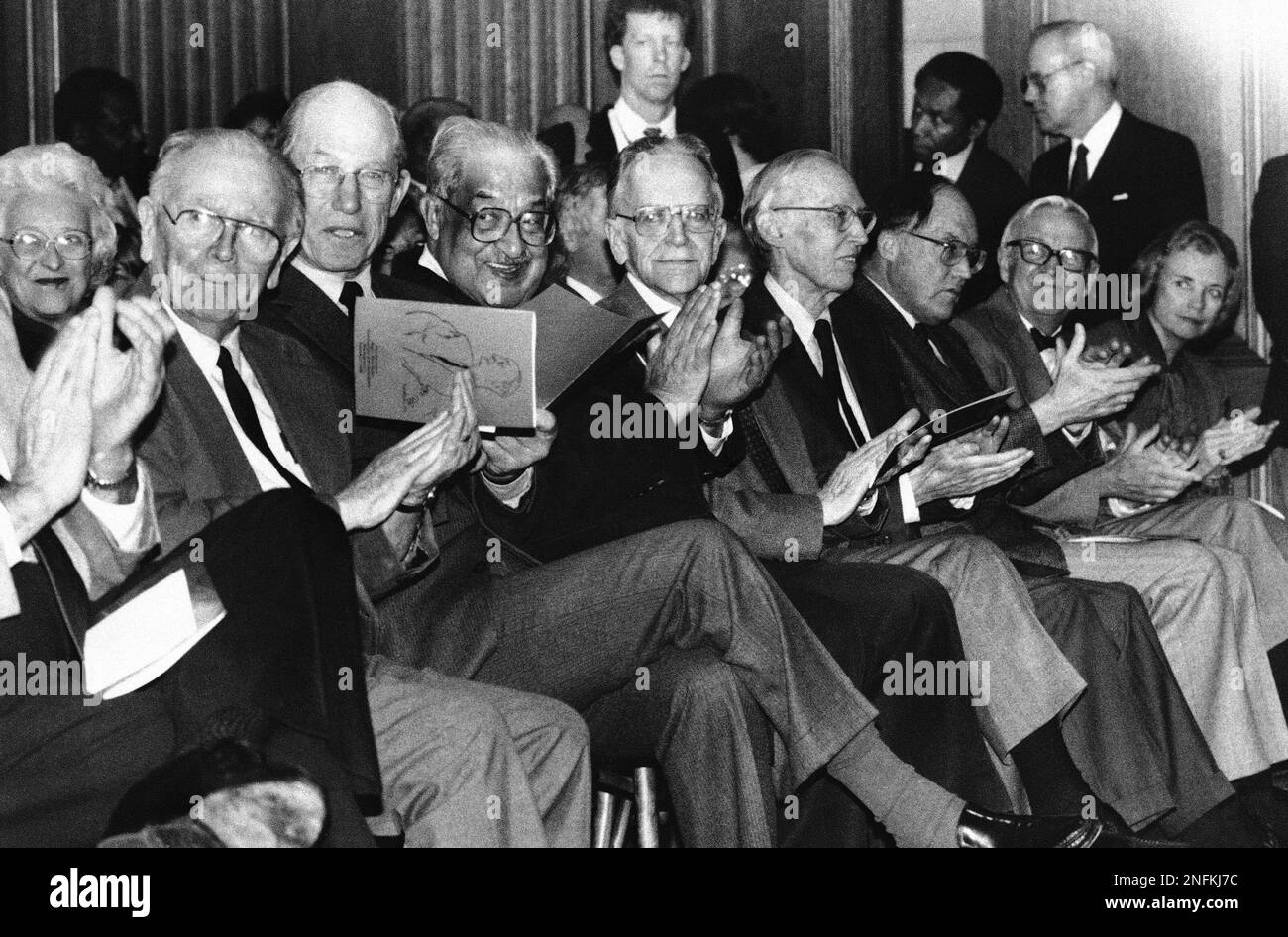 Members of the Supreme Court applaud during ceremonies held at the ...