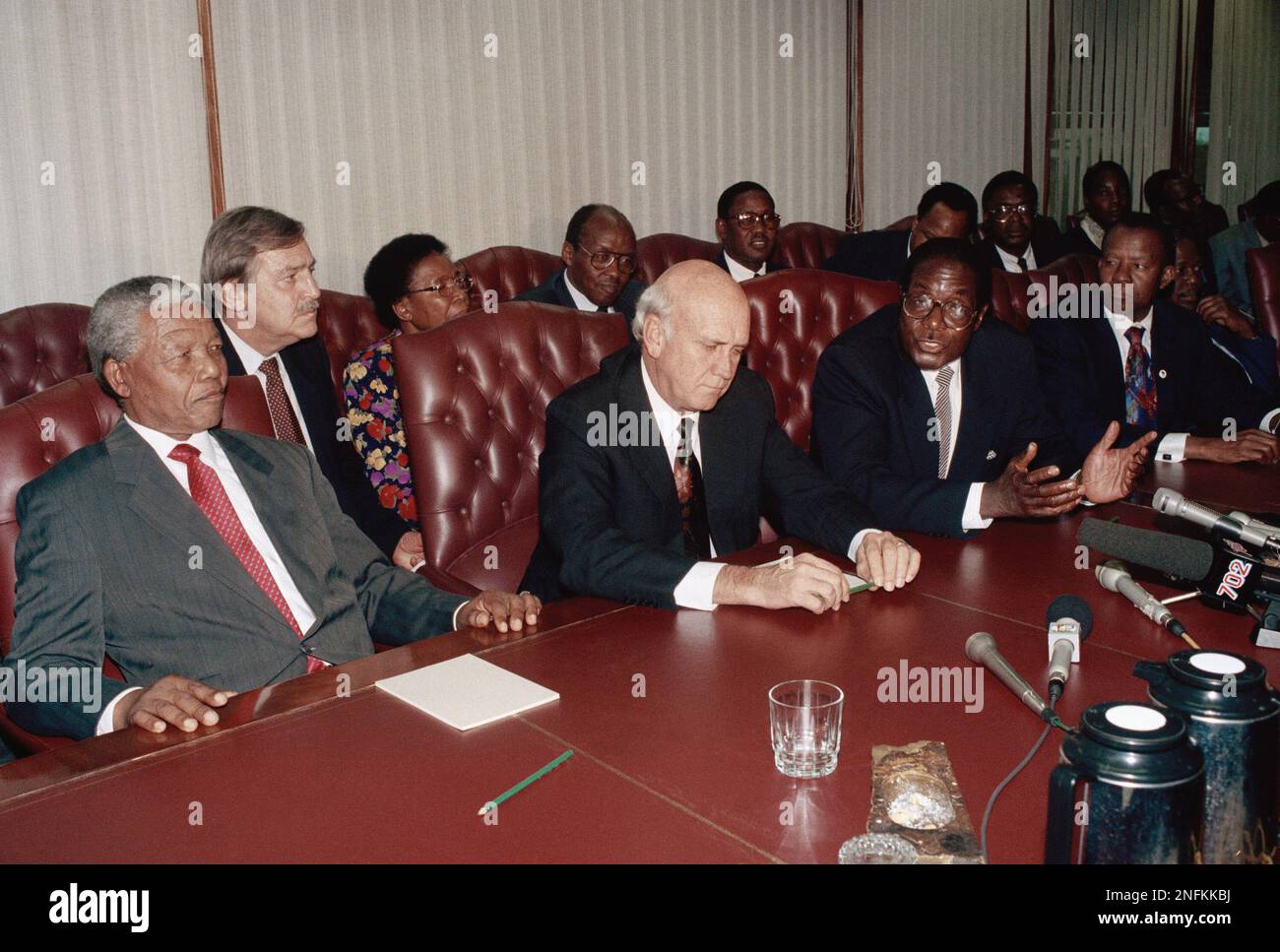 Seated at a table during a press conference in Gaborone, Botswana, on Wednesday, Jan. 26, 1994 ...