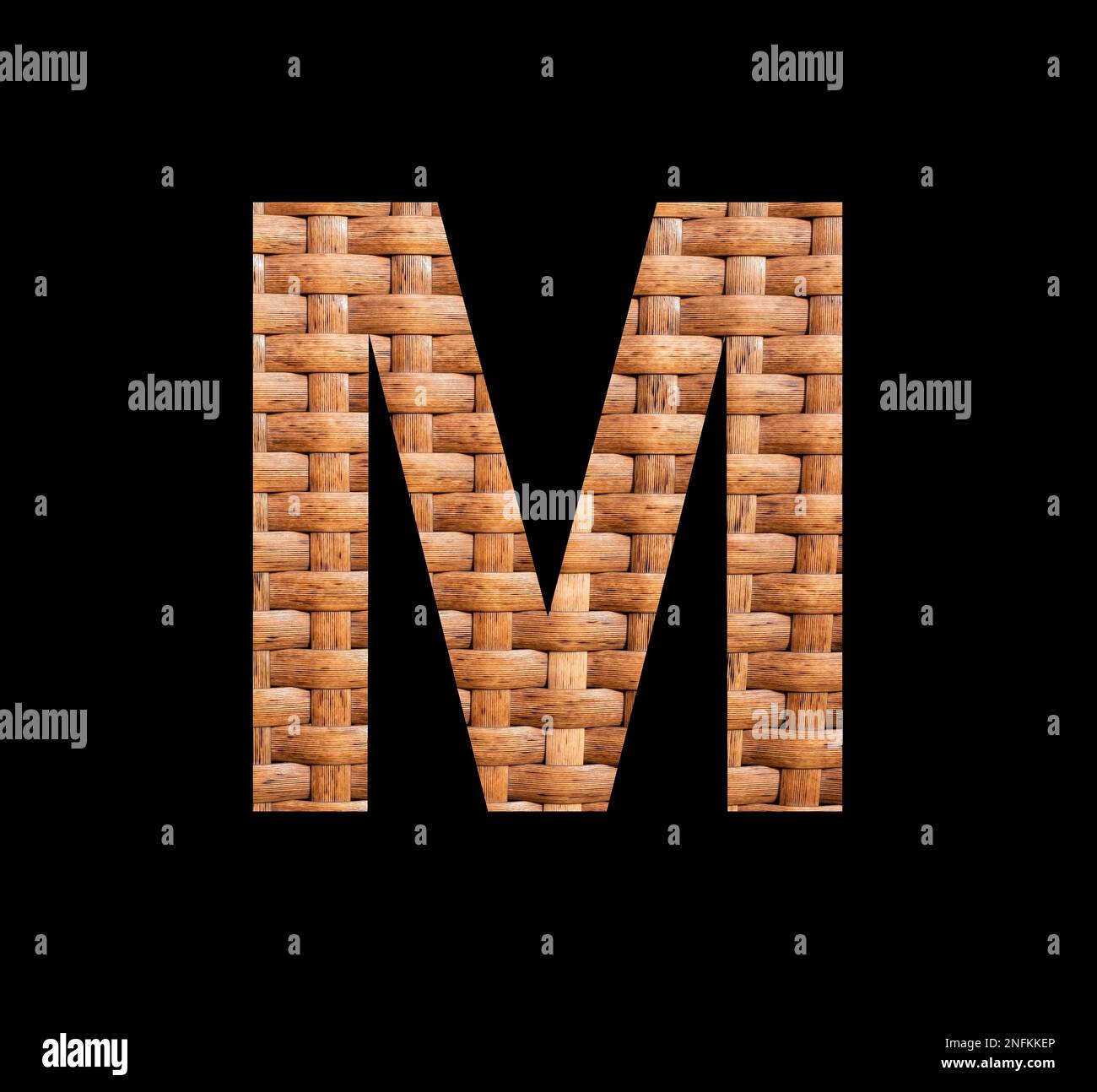 Uppercase letter M - Symmetrically intertwined natural rattan ...