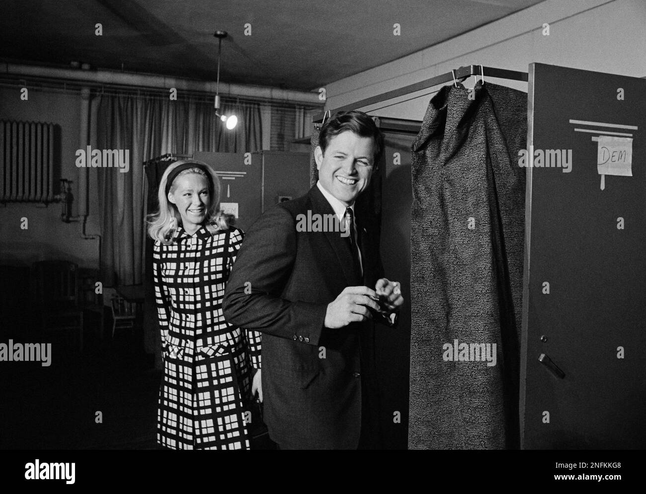 Sen. Edward Kennedy (D-Mass), right, shown with wife Joan, displays pen ...