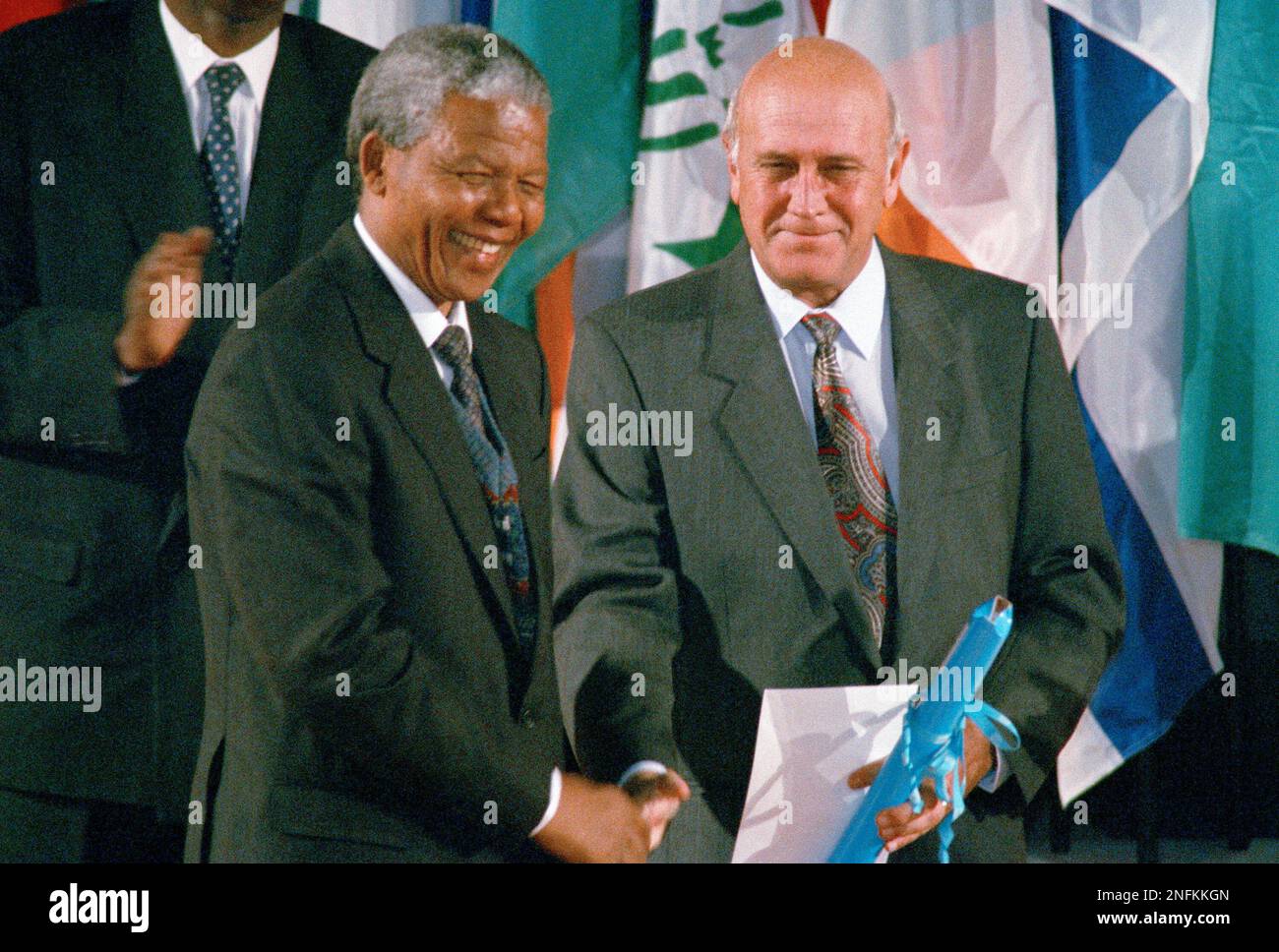South African President Frederic De Klerk, right, shakes hands with ANC ...