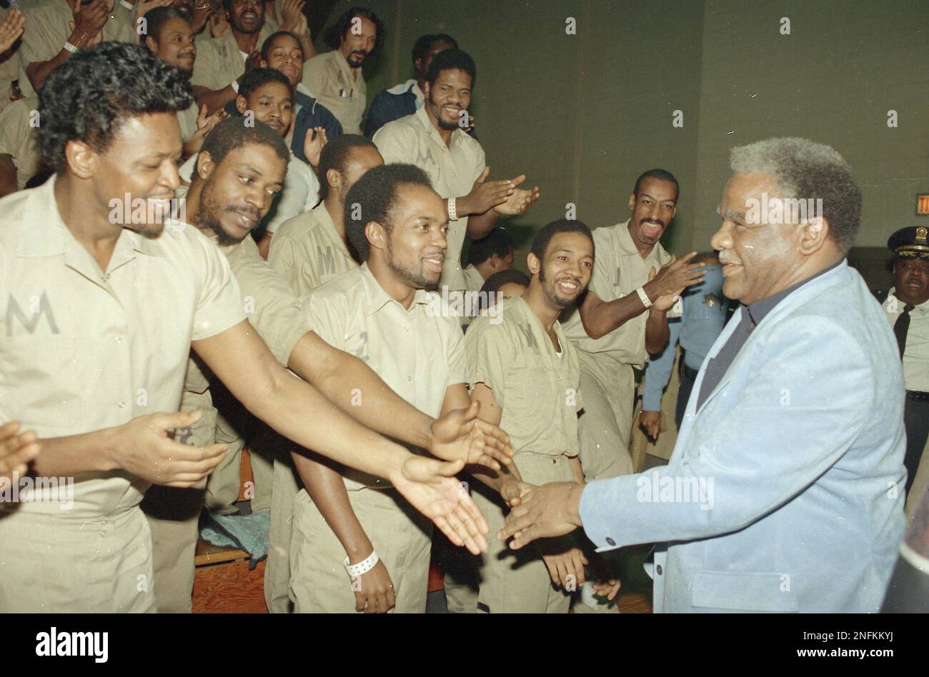 Chicago Mayor Harold Washington, left, shakes hands with inmates at ...
