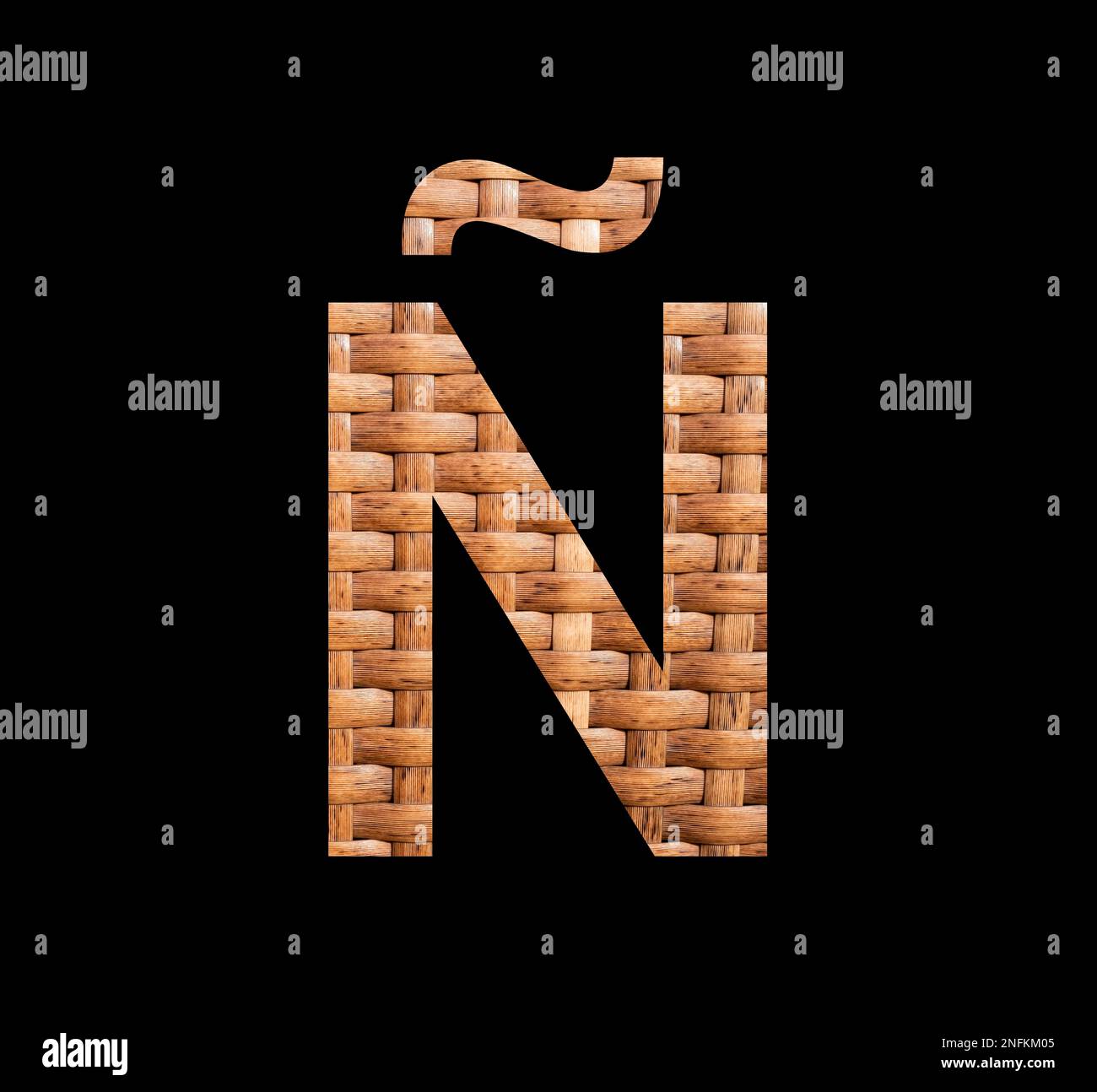 Uppercase letter Ñ - Symmetrically intertwined natural rattan ...