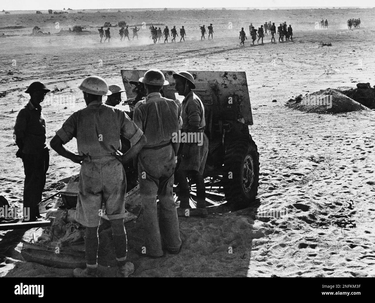 In this image provided by the British Press Service, artillery and ...