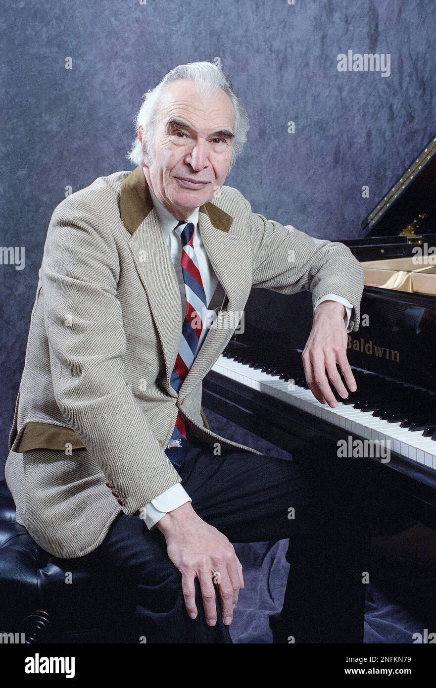 Jazz pianist composer Dave Brubeck poses with his piano following an ...