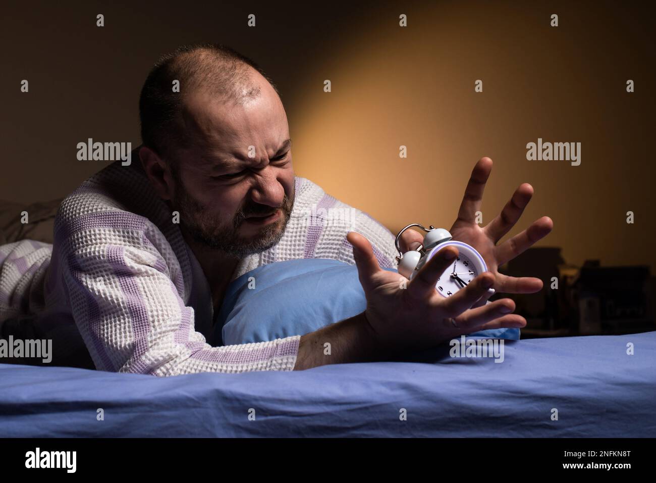 Angry man alarm clock in hi-res stock photography and images - Alamy