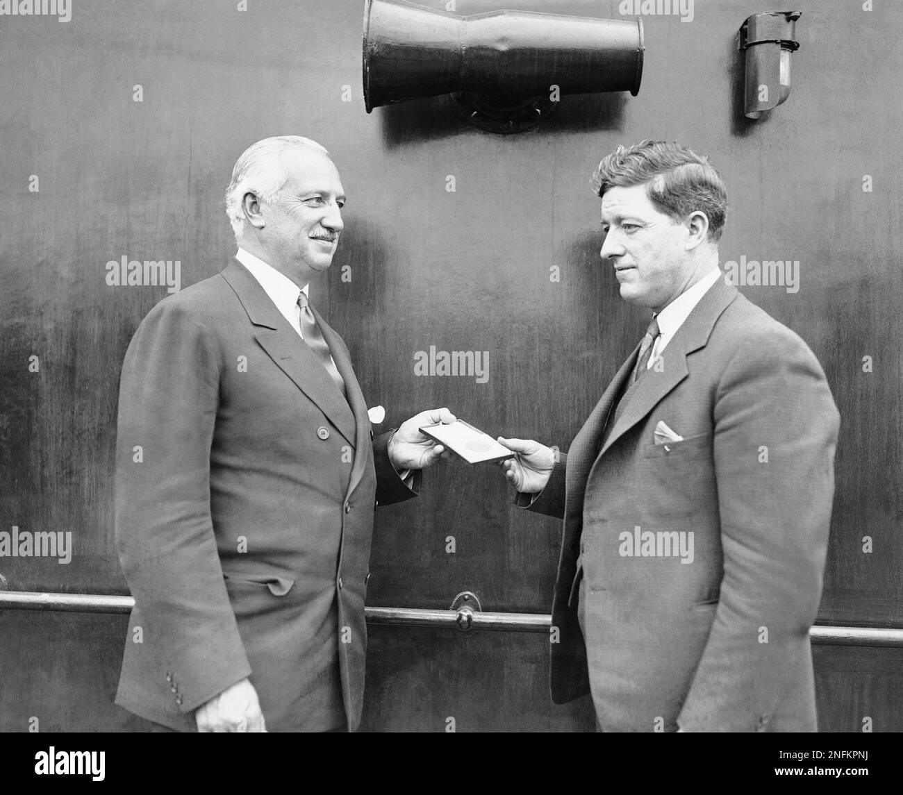 Captain Flavel M. Williams, right, inventor of the fog navigating ...