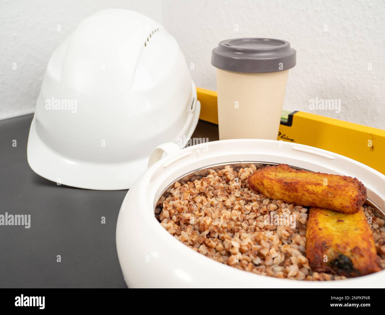 Thermos for food on the table. Lunch break. Close-up Stock Photo - Alamy