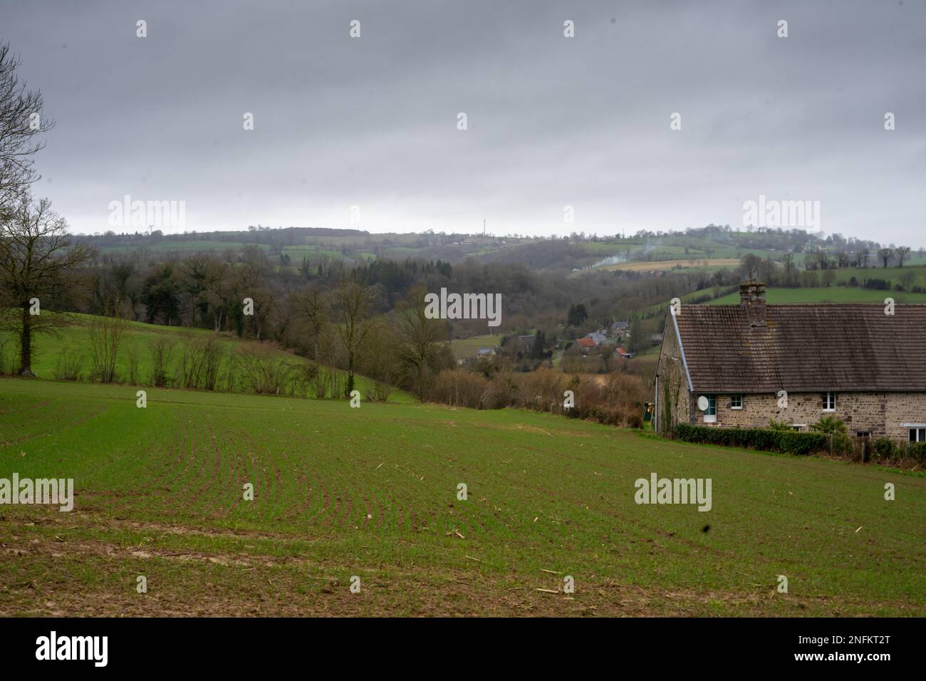 Several houses and green meadows. Countryside in France Stock Photo - Alamy